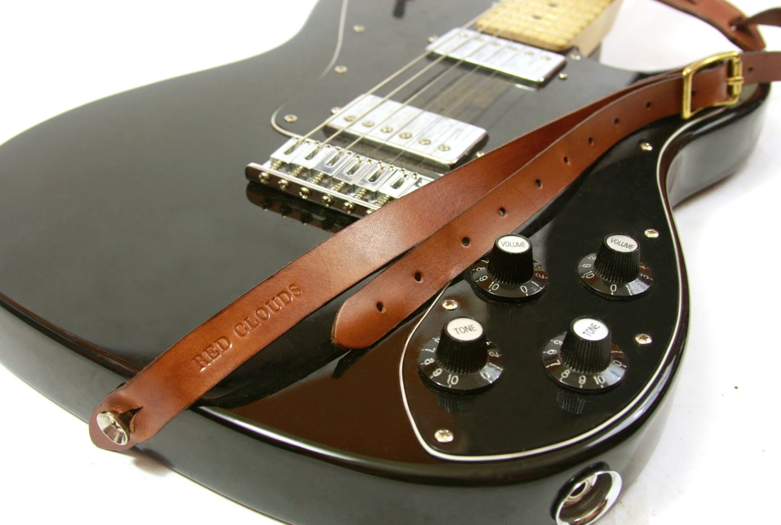How To Put On a Guitar Strap: Tuning and Attachment - Zager Guitar Blog